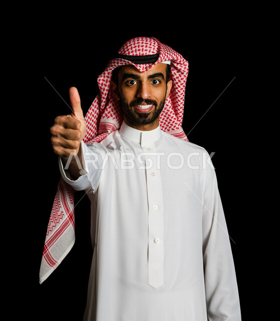 A Saudi Arabian Gulf man wearing a Saudi dress, gestures of the face ...