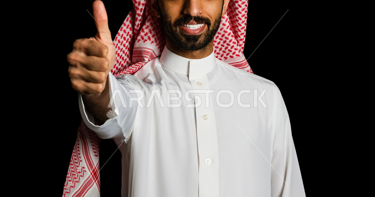 A Saudi Arabian Gulf man wearing a Saudi dress, gestures of the face ...