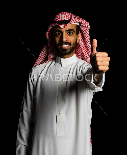 A Saudi Arabian Gulf man wearing a Saudi dress, gestures of the face ...