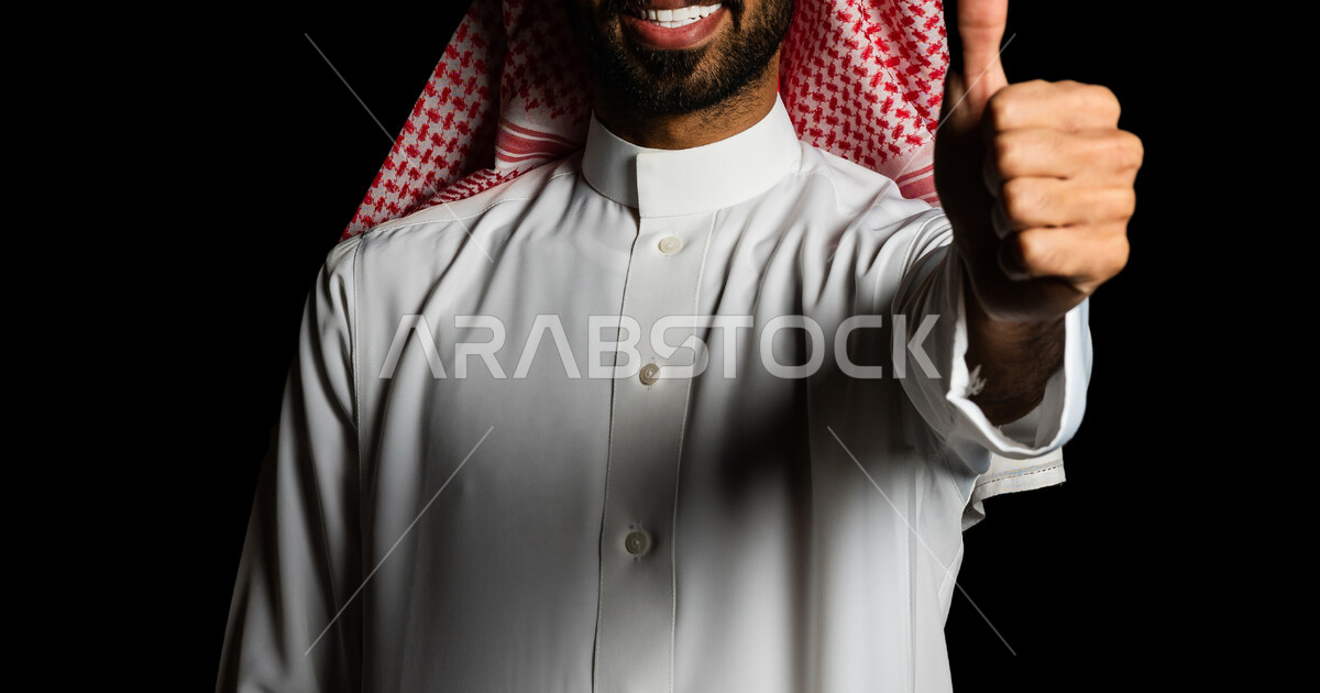 A Saudi Arabian Gulf man wearing a Saudi dress, gestures of the face ...