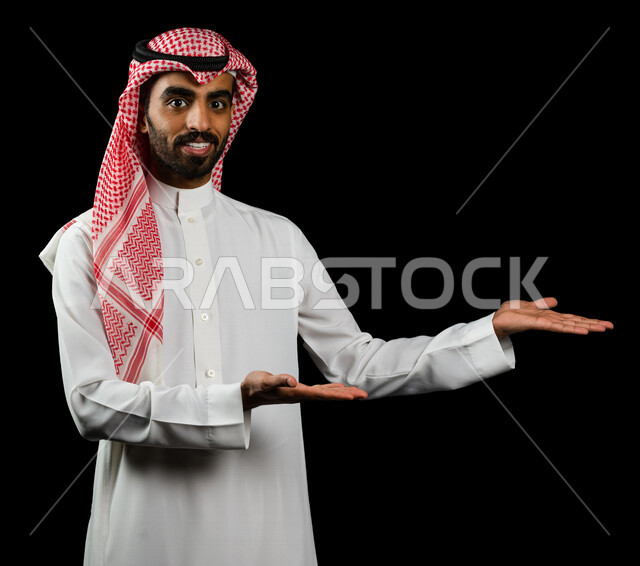 A Saudi Arabian Gulf man wearing Saudi dress, two hand gestures ...
