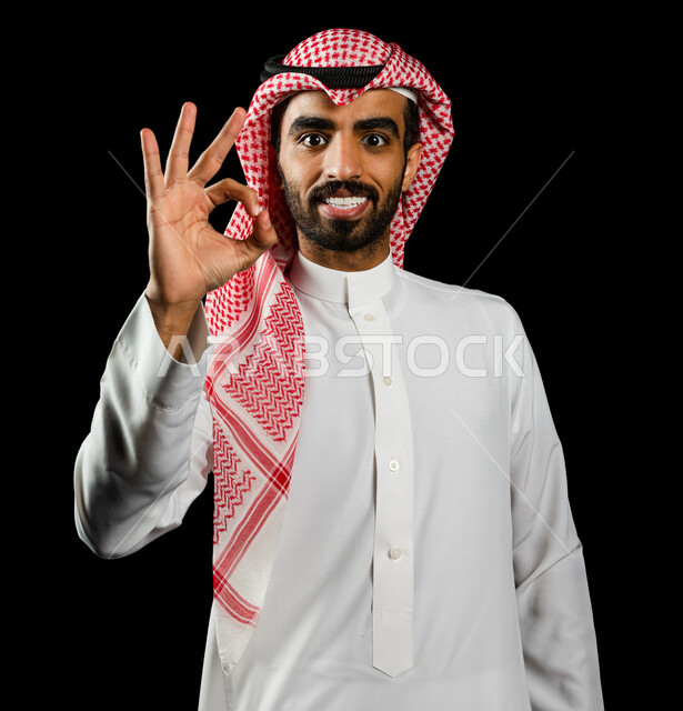 A Saudi Arabian Gulf man in Saudi uniform, facial and hands gestures ...