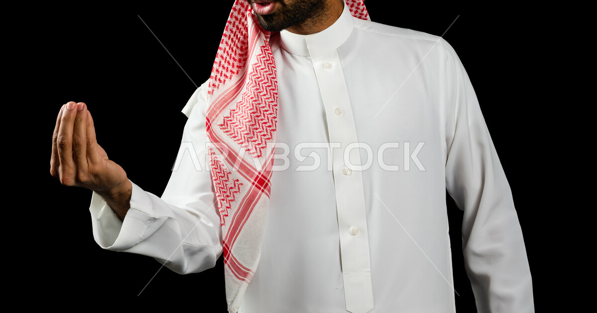 A Saudi Arabian Gulf man wearing a Saudi dress, hand gestures ...