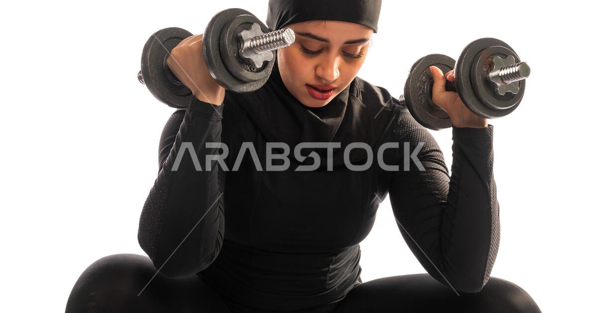Portrait of a veiled Saudi Arabian woman wearing a sportswear ...