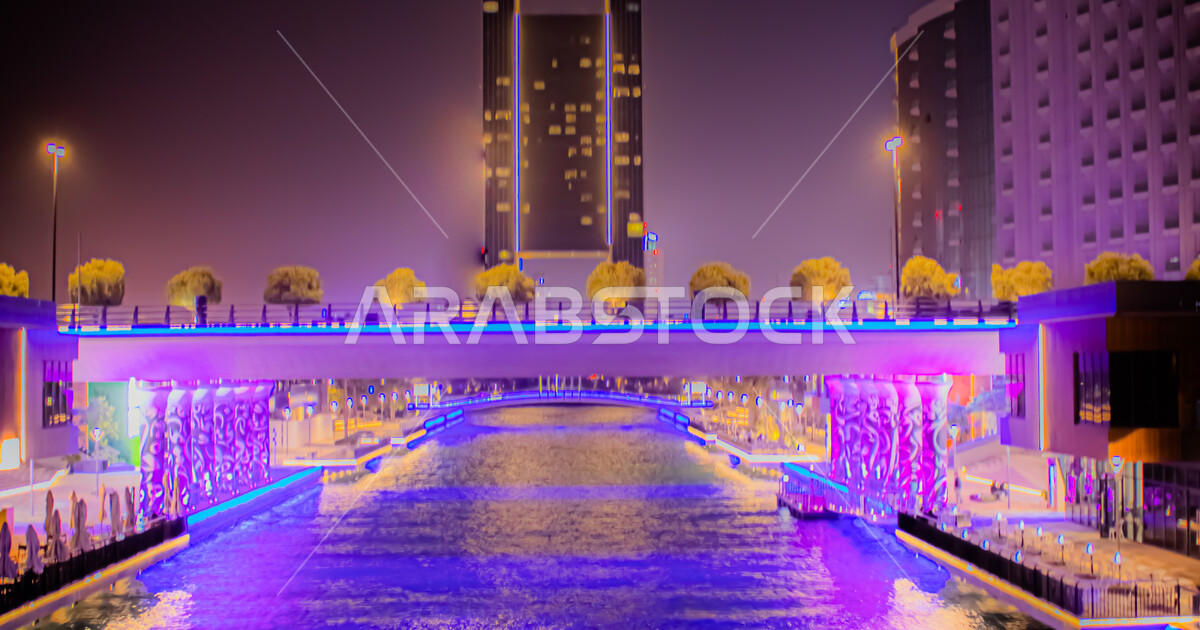 Night photo of Four Seasons Hotel Bahrain Bay with purple lighting in ...