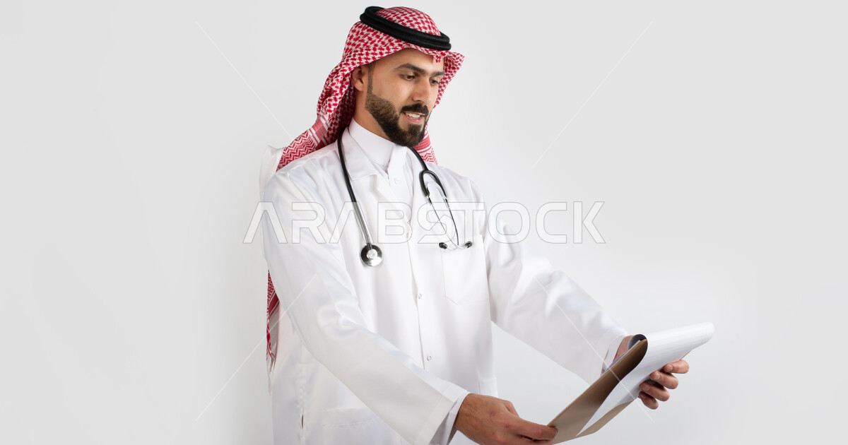 Portrait of a Saudi Arabian male doctor following a patient's ...