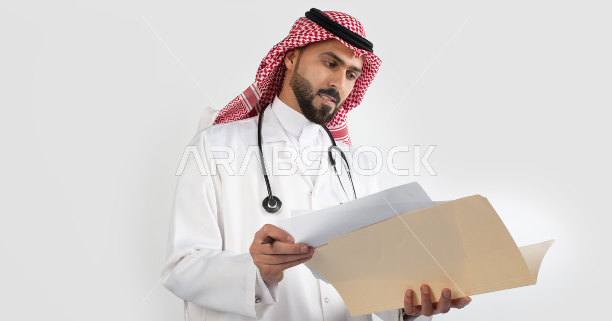 Portrait of a Saudi Arabian male doctor following a patient's ...