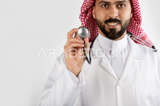 Portrait of a Saudi Arabian doctor, with a stethoscope, white ...