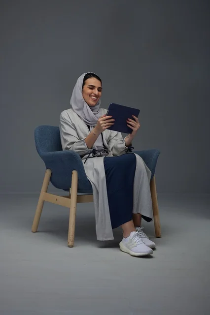 Saudi Female Physician Using Tablet in Studio - Photo