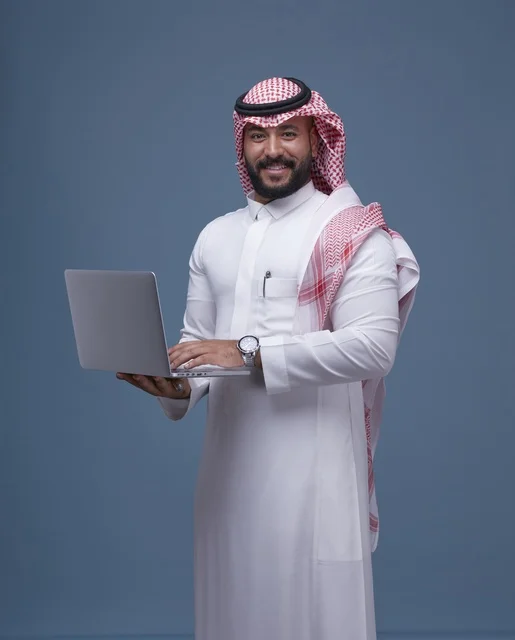 Saudi Businessman in Traditional Attire in Modern Office - Photo