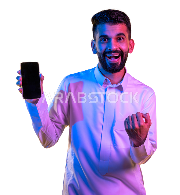 Portrait of a Saudi Arabian Gulf youth displaying a mobile phone device ...