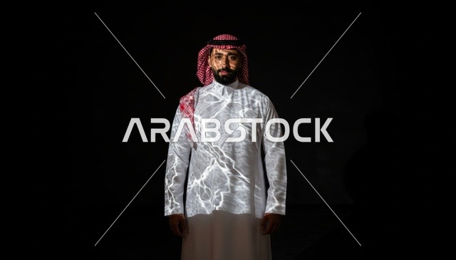 Saudi Man in Traditional Attire with Map Projection - Photo