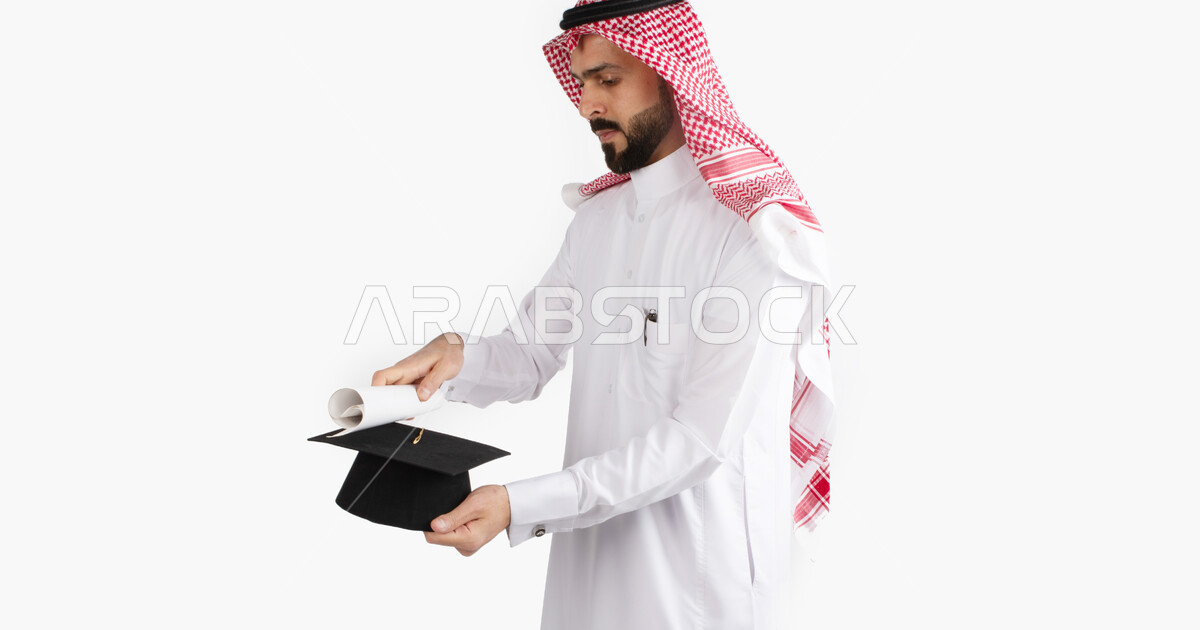 Happy Saudi Arabian graduate with graduation certificate, young ...