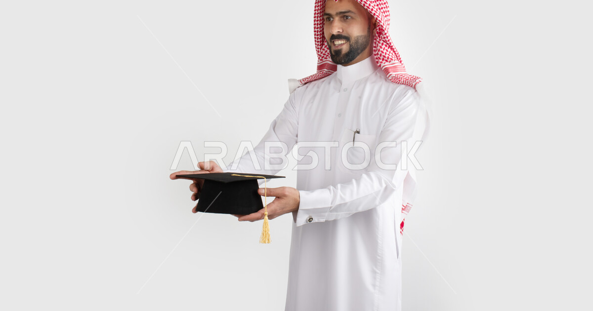 Happy Saudi Arabian graduate with graduation certificate, young ...