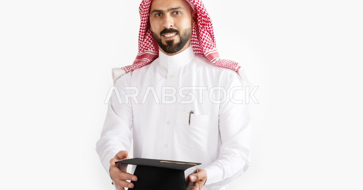 Happy Saudi Arabian graduate with graduation certificate, young ...