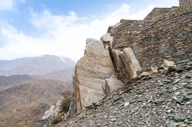 Traditional Stone Wall and Ancient Mountain Architecture - Photo