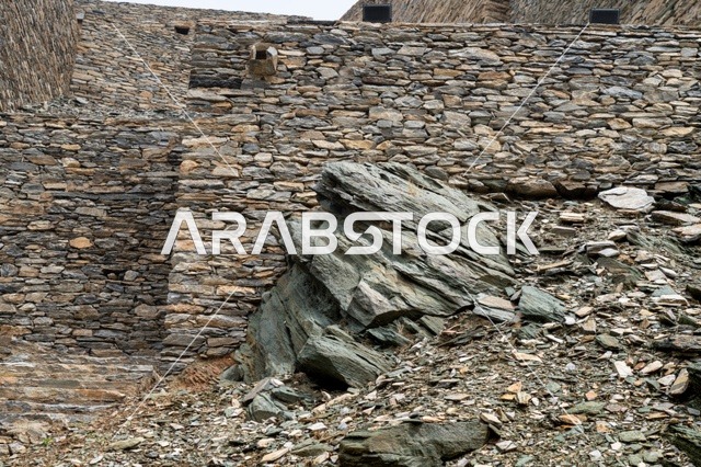 Traditional Stone Wall and Ancient Mountain Architecture - Photo