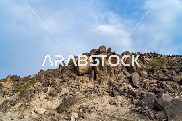 Rocky Mountain Desert Hillside under Cloudy Sky - Photo