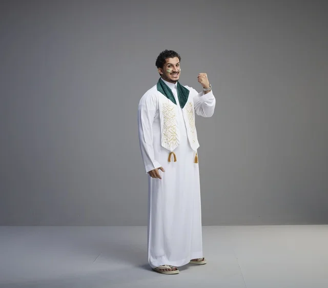 Saudi Boy in Traditional Dress Celebrating Space Success - Photo