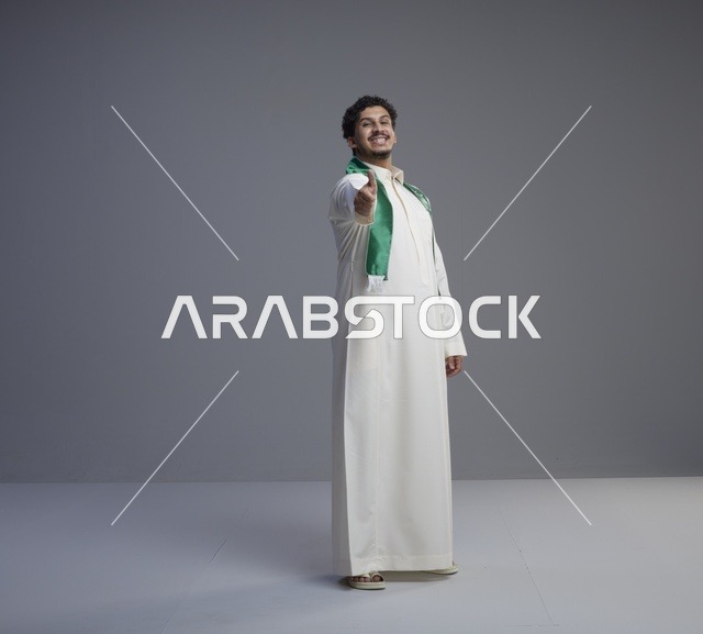 Saudi Man in Thobe with National Scarf in Studio - Photo