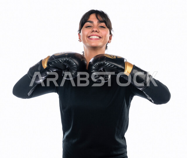 Portrait of a Saudi girl wearing boxing uniforms and boxing gloves ...