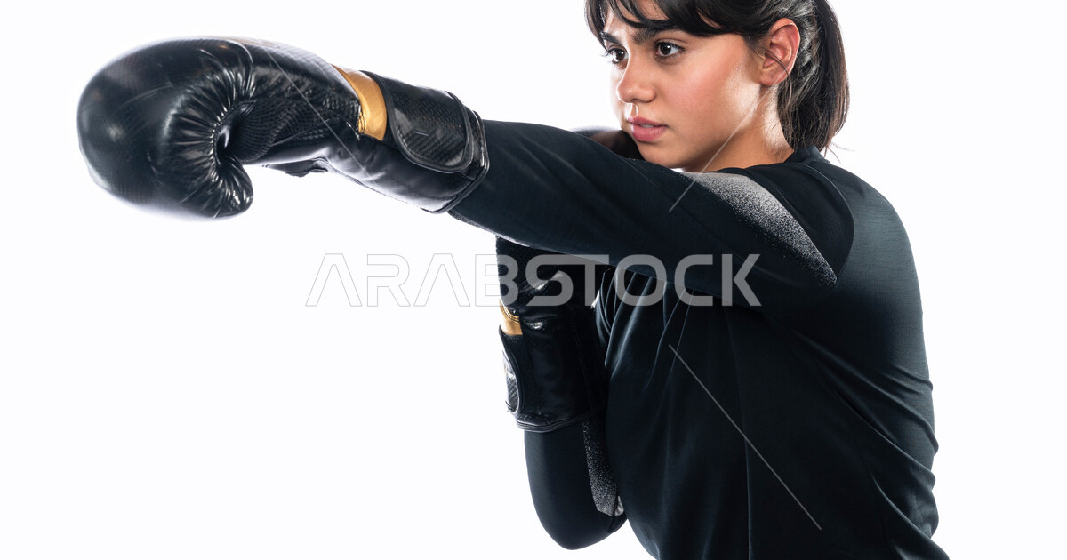 Portrait of a Saudi girl wearing boxing uniforms and boxing gloves ...