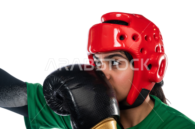 Portrait of a Saudi girl wearing boxing uniform, helmet and boxing ...