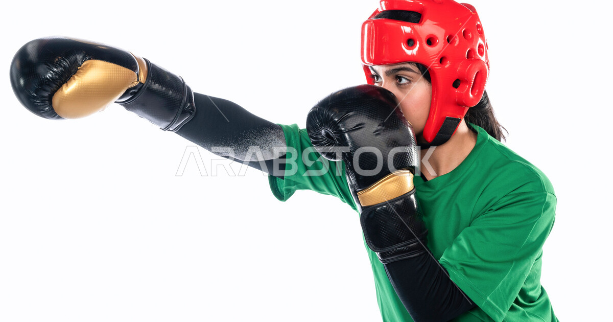 Portrait of a Saudi girl wearing boxing uniform, helmet and boxing ...