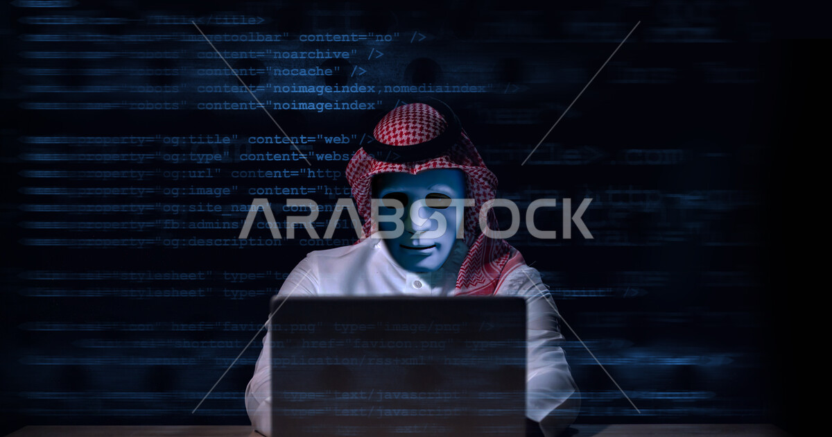 A Saudi Arabian Gulf man wearing an anonymous mask and sitting in front ...