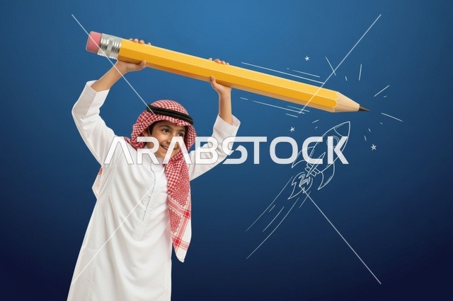 Saudi Boy Holding Giant Pencil for Creative Learning - Photo