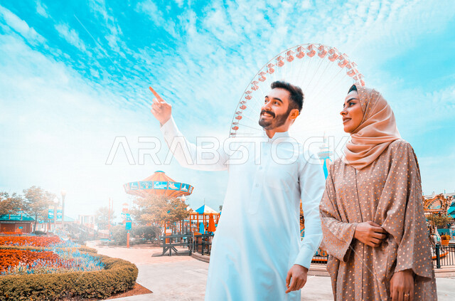 A happy Saudi Arabian Gulf couple in the Winter Wonderland amusement ...