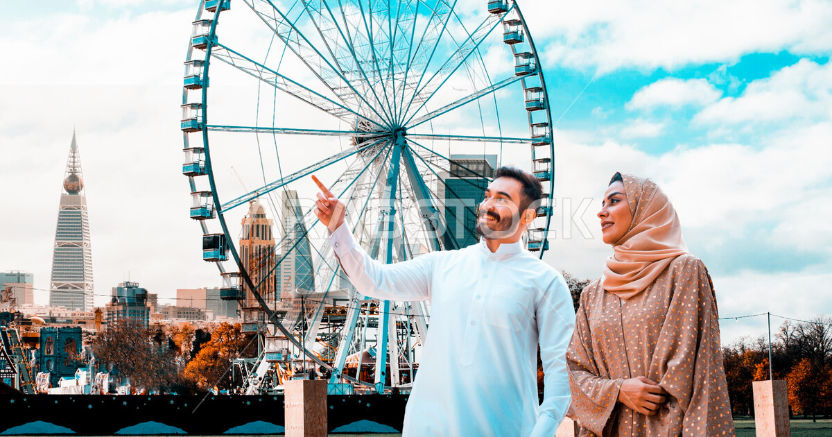A happy Saudi Arabian Gulf couple in the Winter Wonderland amusement ...