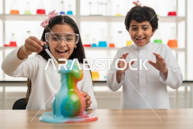 Saudi Children Conducting Science Experiment in Lab - Photo