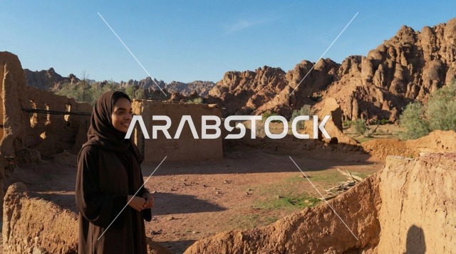 Saudi Woman at Al-Ula Ancient Mud-Brick Ruins - Photo