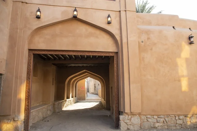Traditional Mud Brick Archway in Arabian Heritage Village - Photo