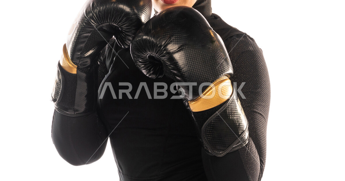 Portrait of a veiled Saudi Arabian Gulf woman in the women's boxing ...