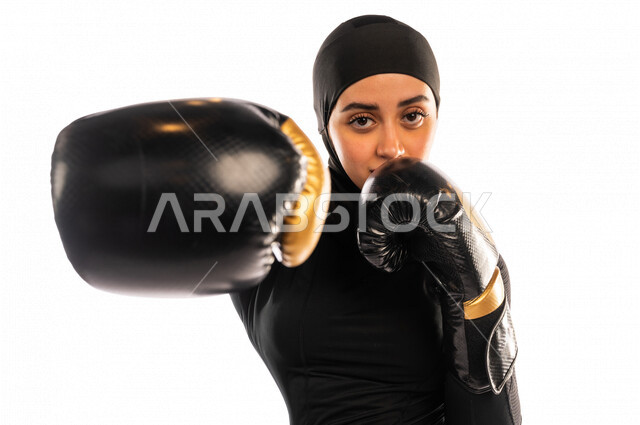 Portrait of a veiled Saudi Arabian Gulf woman in the women's boxing ...