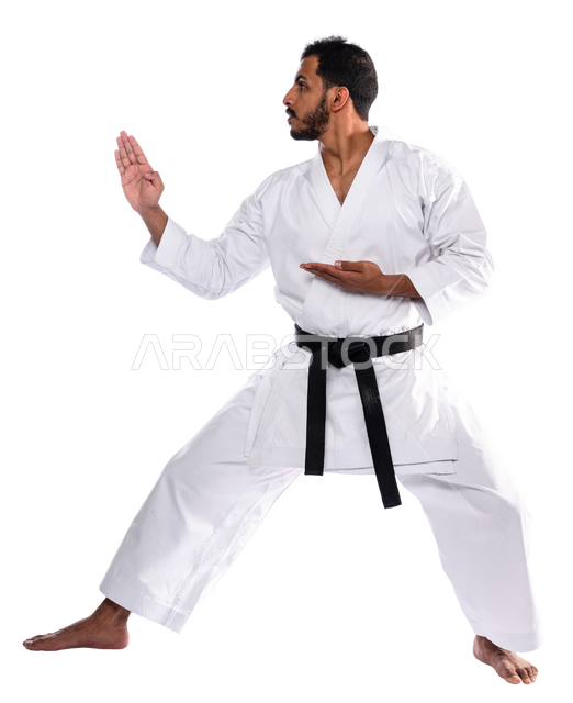 Portrait of a Saudi Arabian Gulf man practicing Japanese karate, white ...