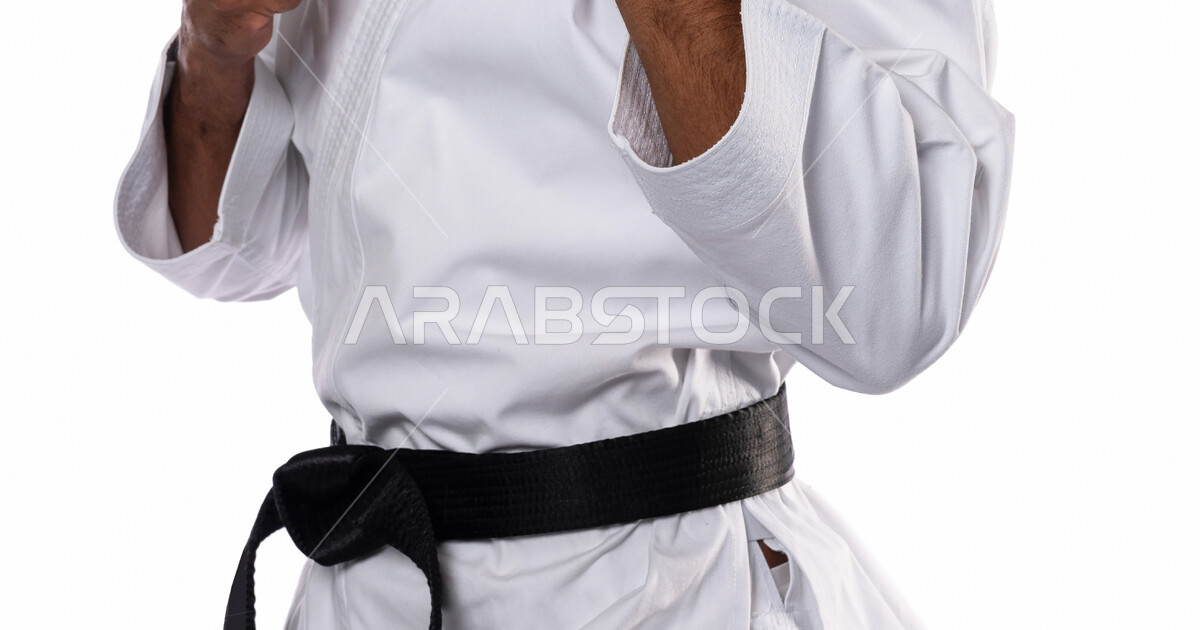 Portrait of a Saudi Arabian Gulf man practicing Japanese karate, white ...