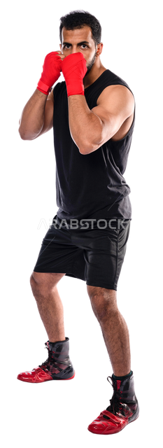 Portrait of a Saudi Arabian Gulf man wearing red boxing bandages ...