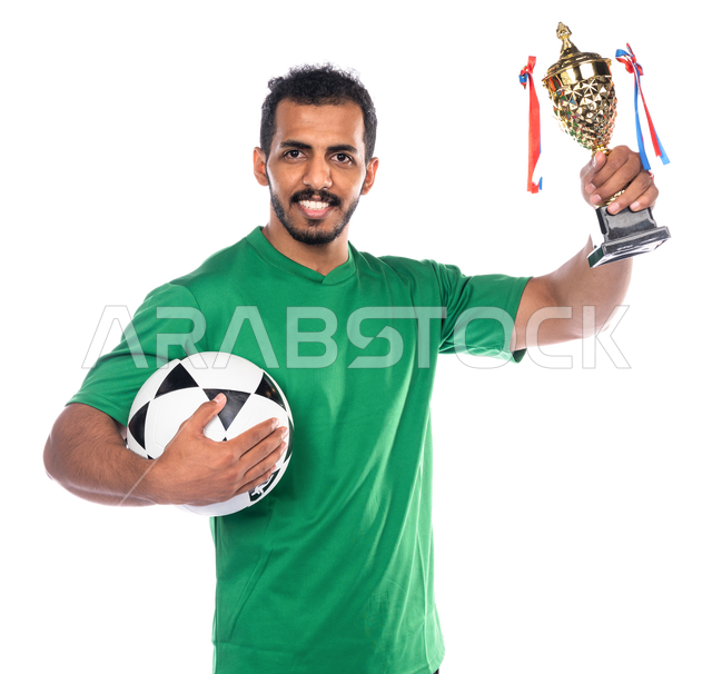 Portrait of a Saudi Arabian Gulf man wearing the football team uniform ...