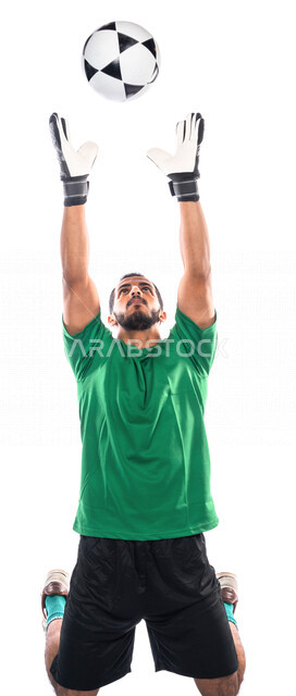 Portrait of a Saudi Arabian Gulf man wearing the football team uniform ...