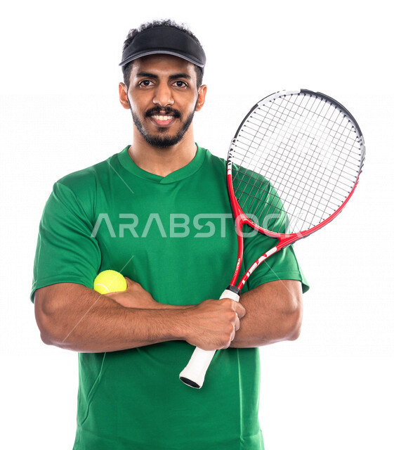 Portrait of a smiling Saudi Arabian Gulf youth wearing sports clothes ...