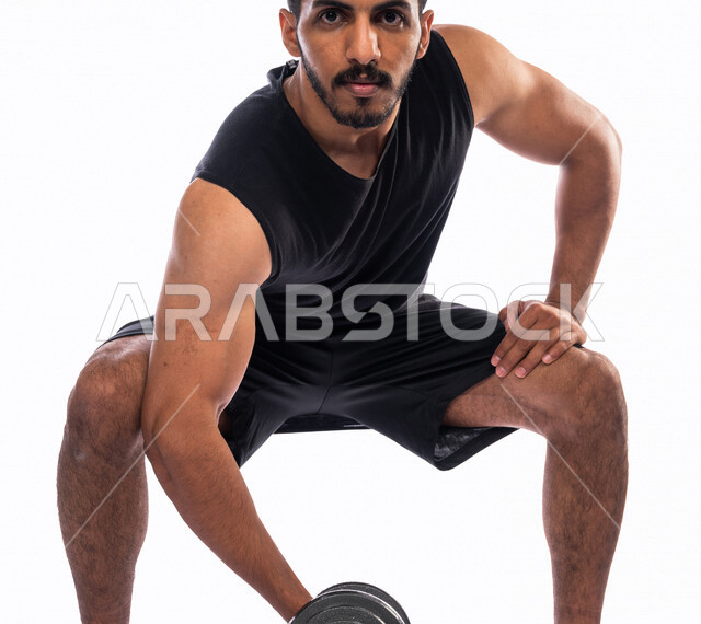 A close-up of a Saudi Arabian Gulf youth doing aerobic exercise with ...