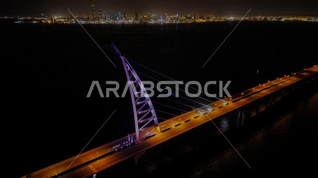 Night picture of the arch edifice on the Sheikh Jaber Al-Ahmad Al-Sabah ...