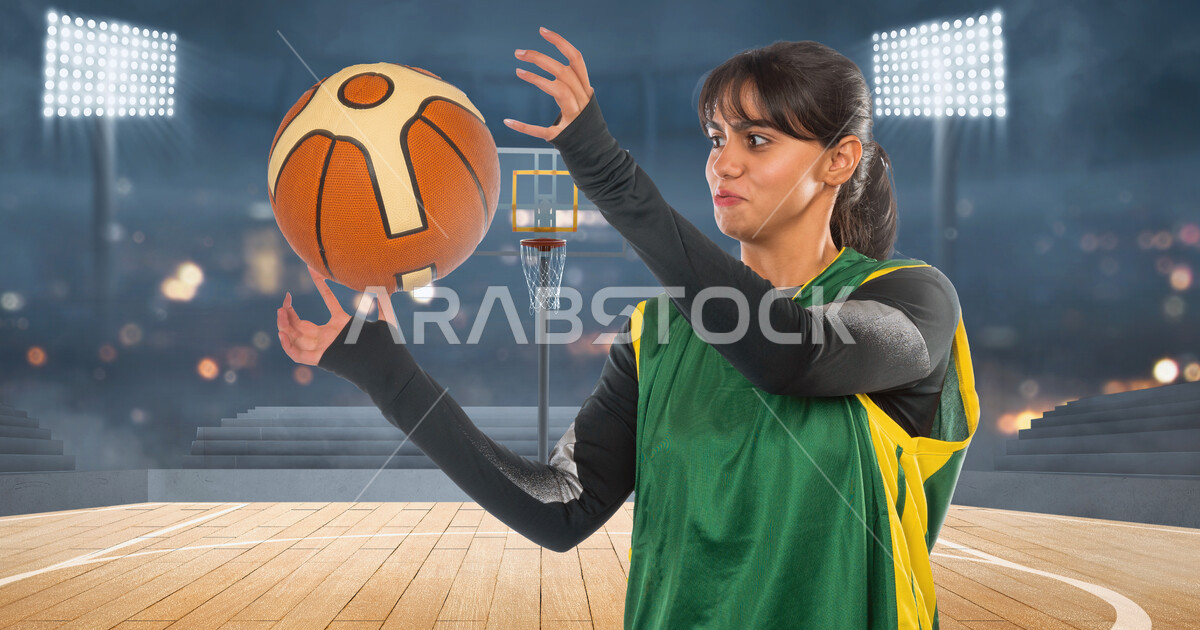 A Saudi Arabian Gulf girl holding a basketball in the court, wearing ...