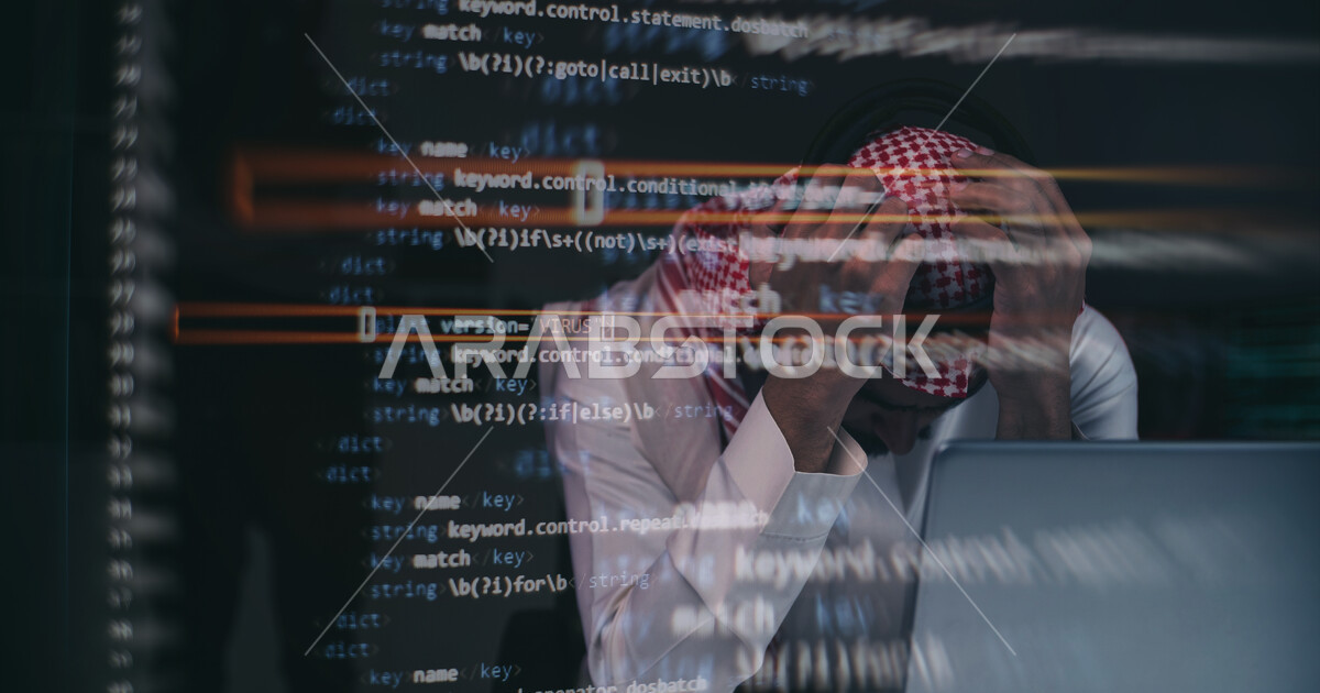 A Saudi Arabian Gulf man sitting in front of the laptop with gestures ...