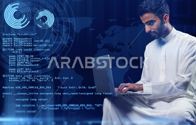 A Saudi Arabian Gulf man working as a web developer using a laptop ...