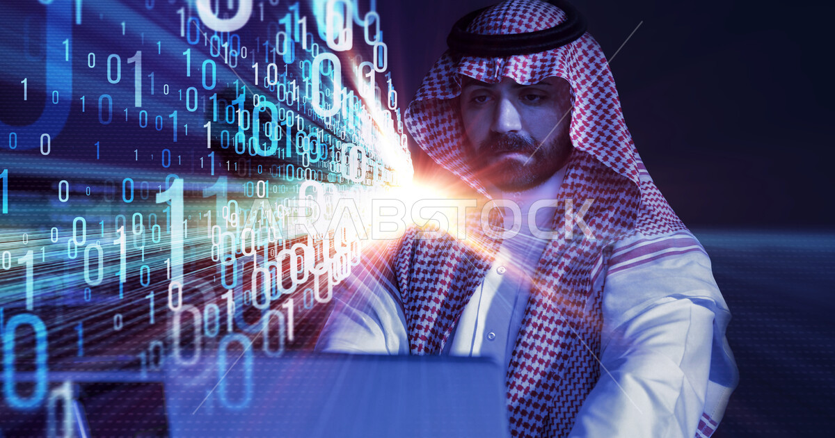 A Saudi Arabian Gulf man, using his laptop, a set of numbers and codes ...