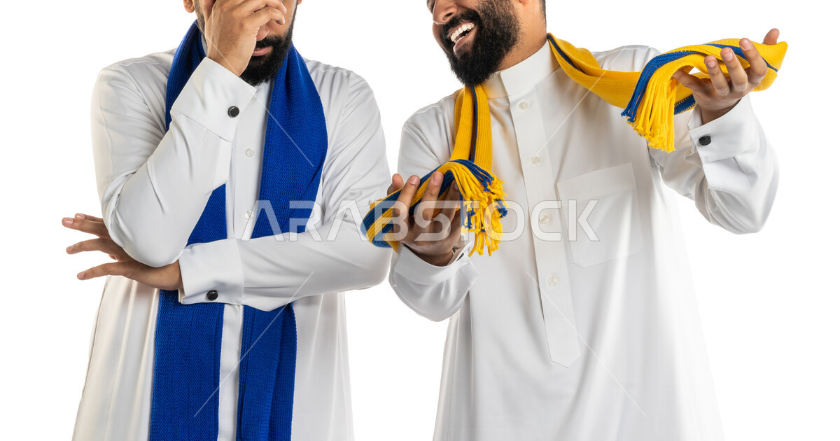 Portrait of two Saudi Arabian Gulf twin men, one wearing the Al-Nasr ...